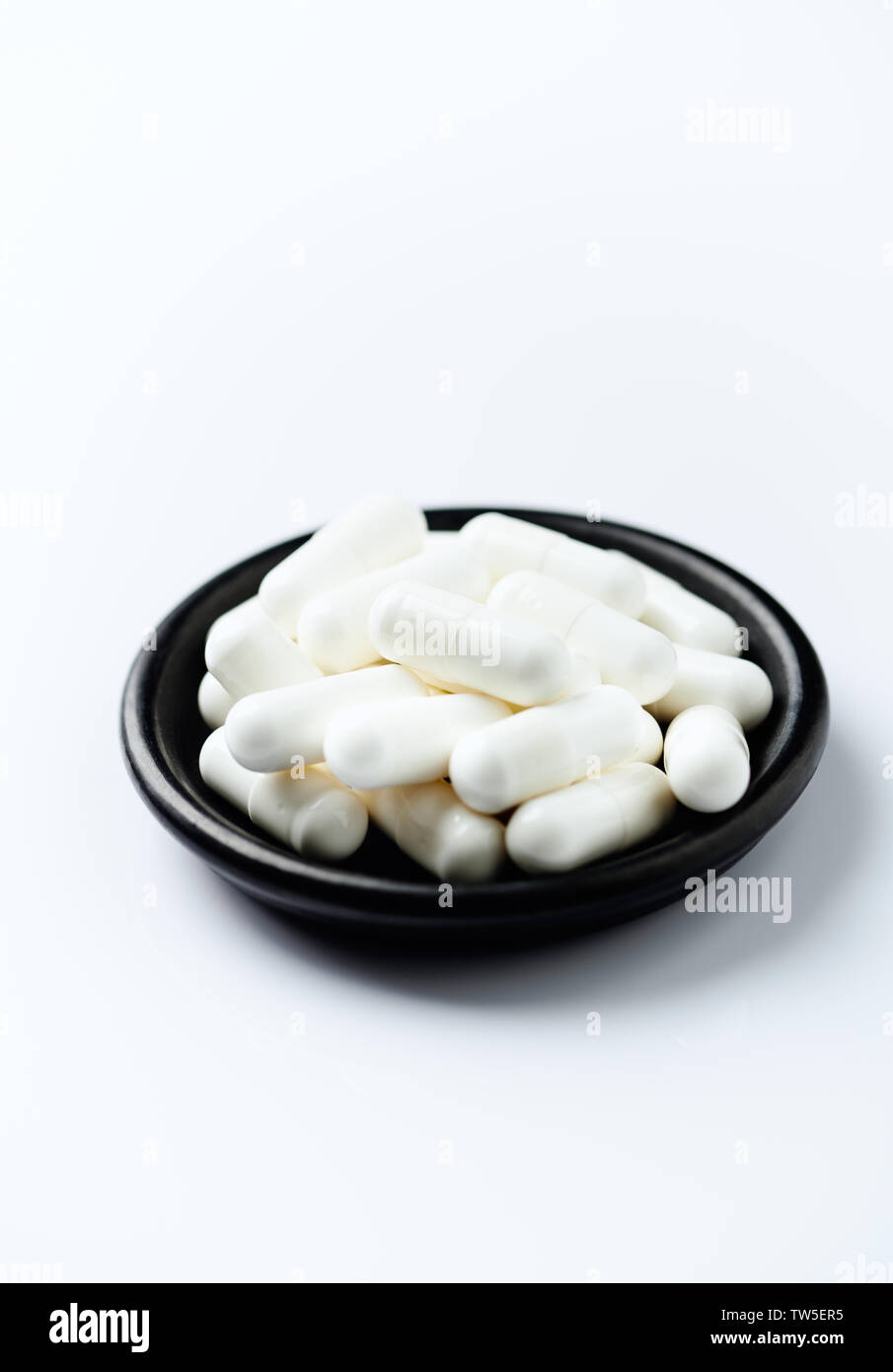 Creatine capsules. Bodybuilding food supplement on white background ...