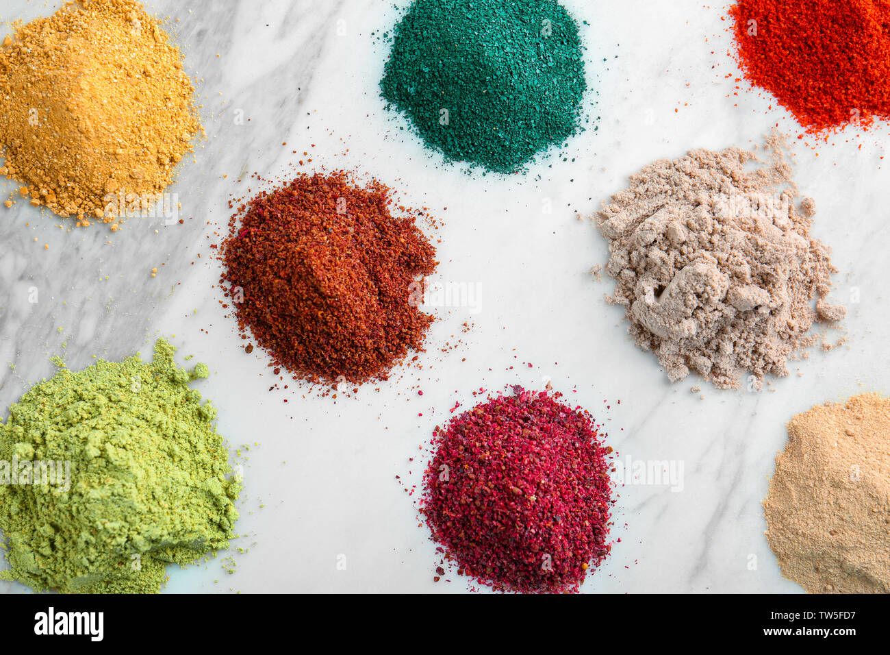 Various colorful superfood powders on light background Stock Photo - Alamy