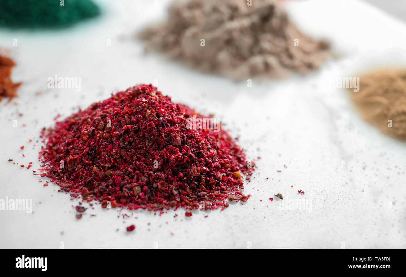 Pile of maqui berry powder on white background Stock Photo - Alamy