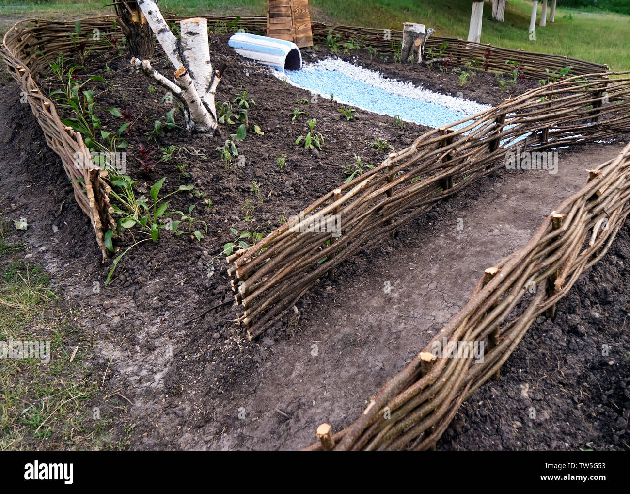 Garden with artificial stream of rubble. Recycling concept Stock Photo ...
