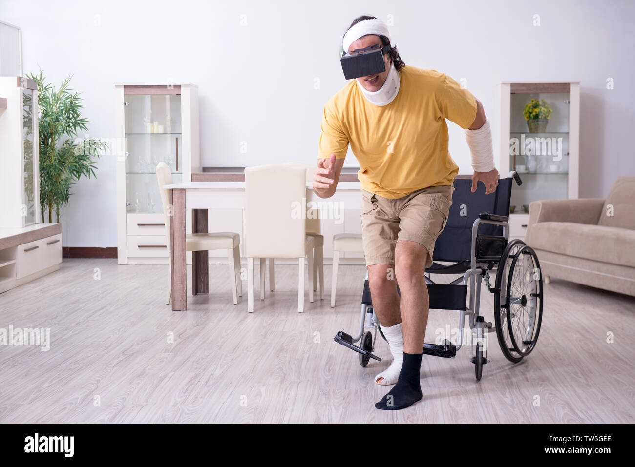 Young man after accident recovering at home Stock Photo - Alamy