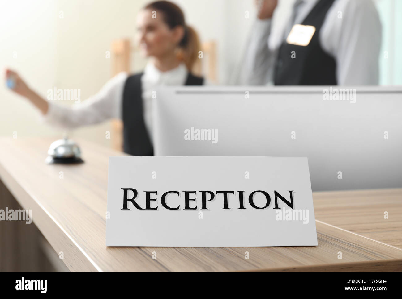 Reception sign on desk in hotel Stock Photo - Alamy
