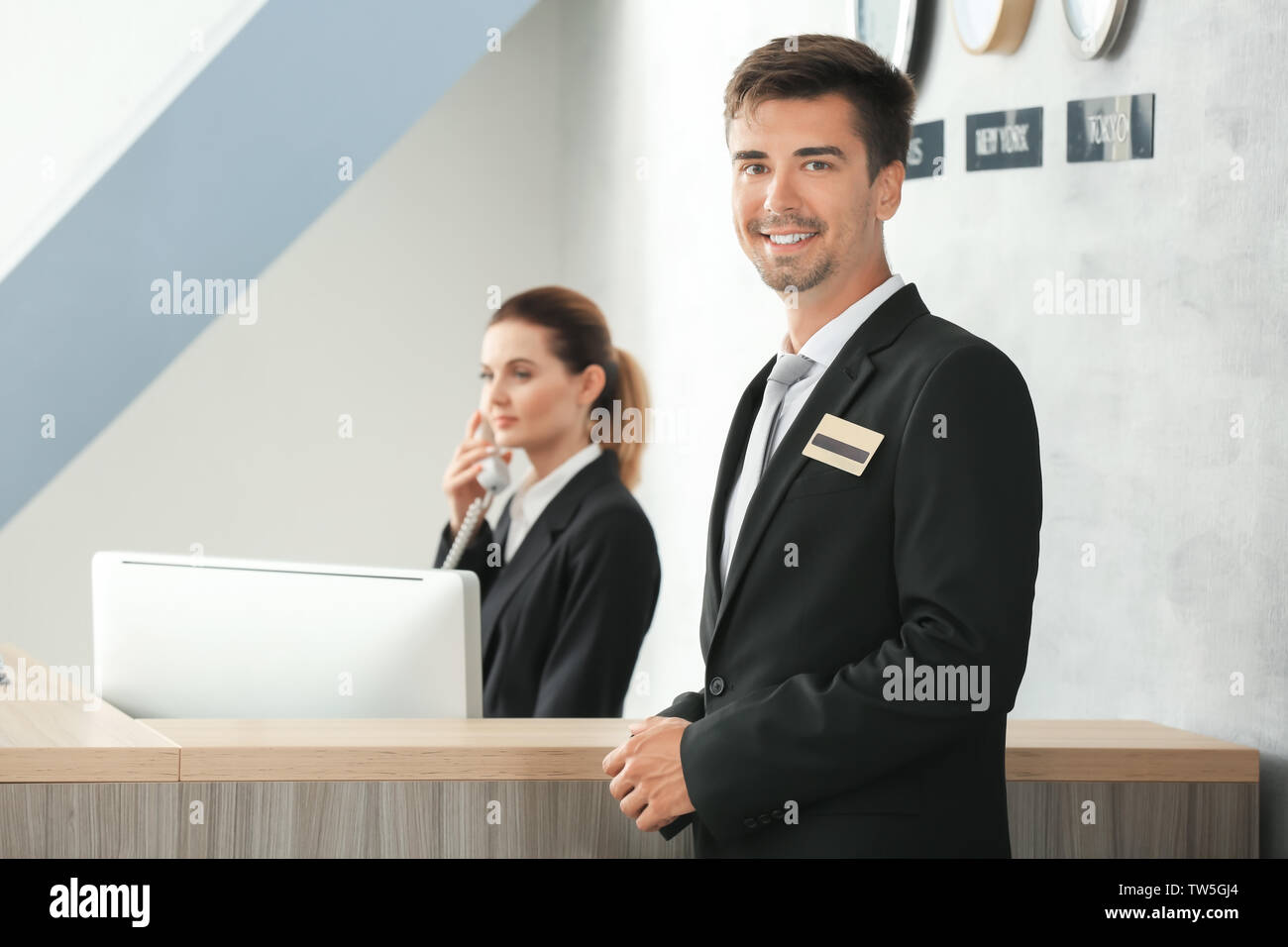 Female receptionist in formal uniform hi-res stock photography and ...