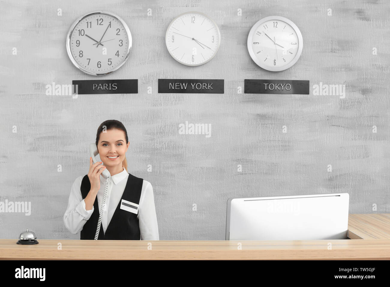 Female receptionist working in hotel Stock Photo - Alamy