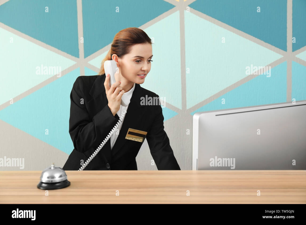 Female receptionist working in hotel Stock Photo - Alamy