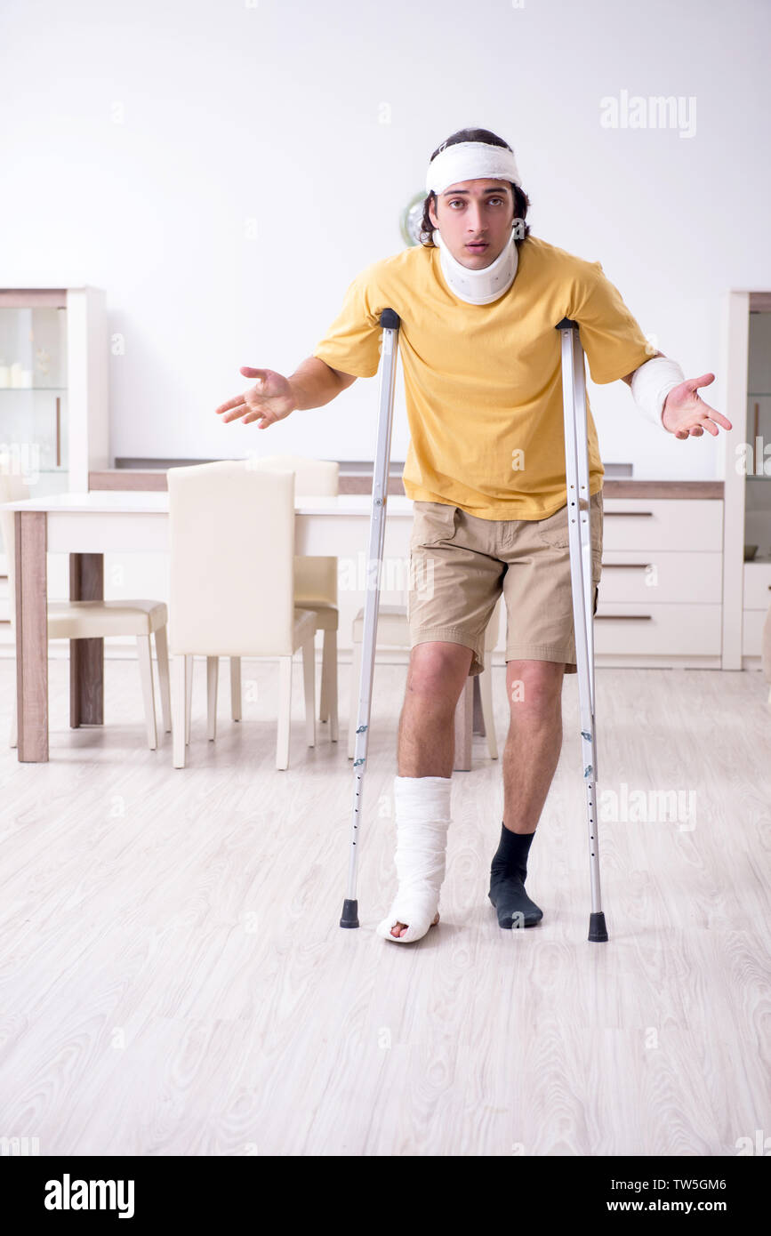 Young man after accident recovering at home Stock Photo - Alamy