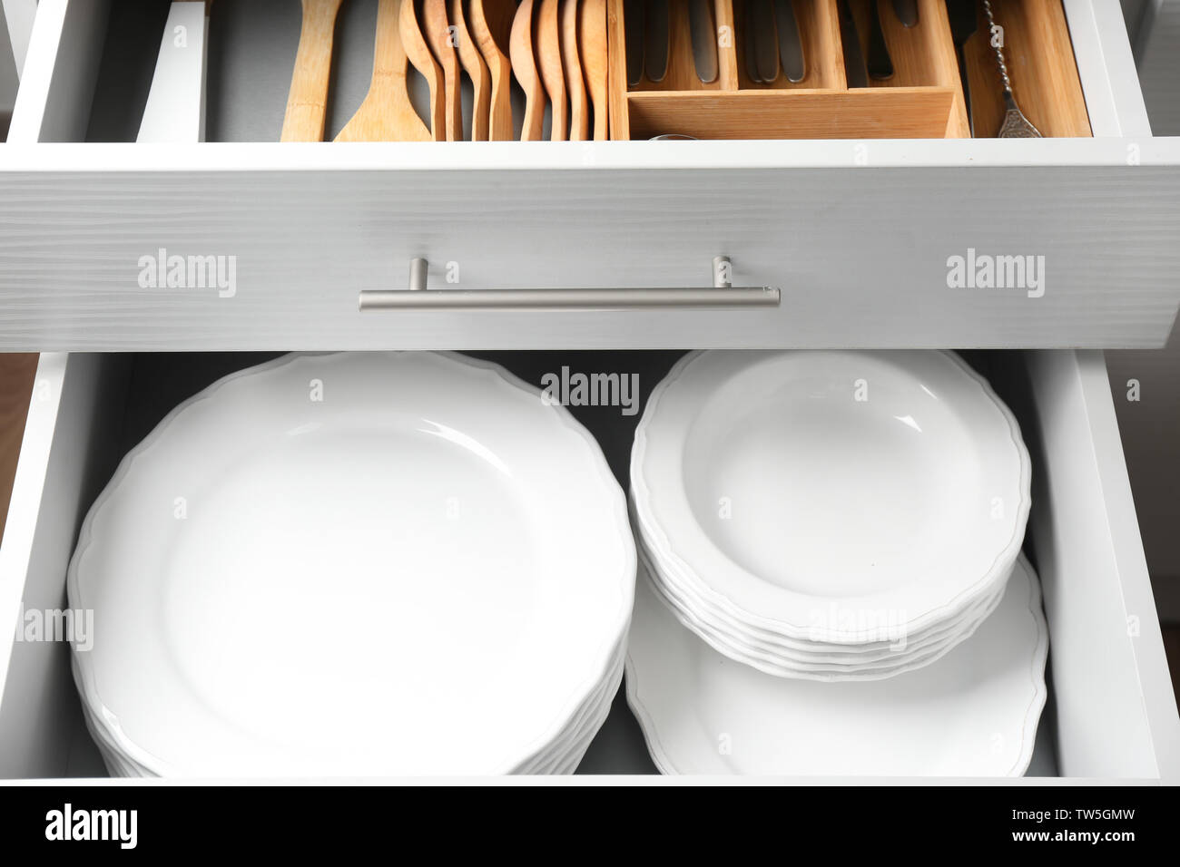 Opened drawer white plates hi-res stock photography and images - Alamy