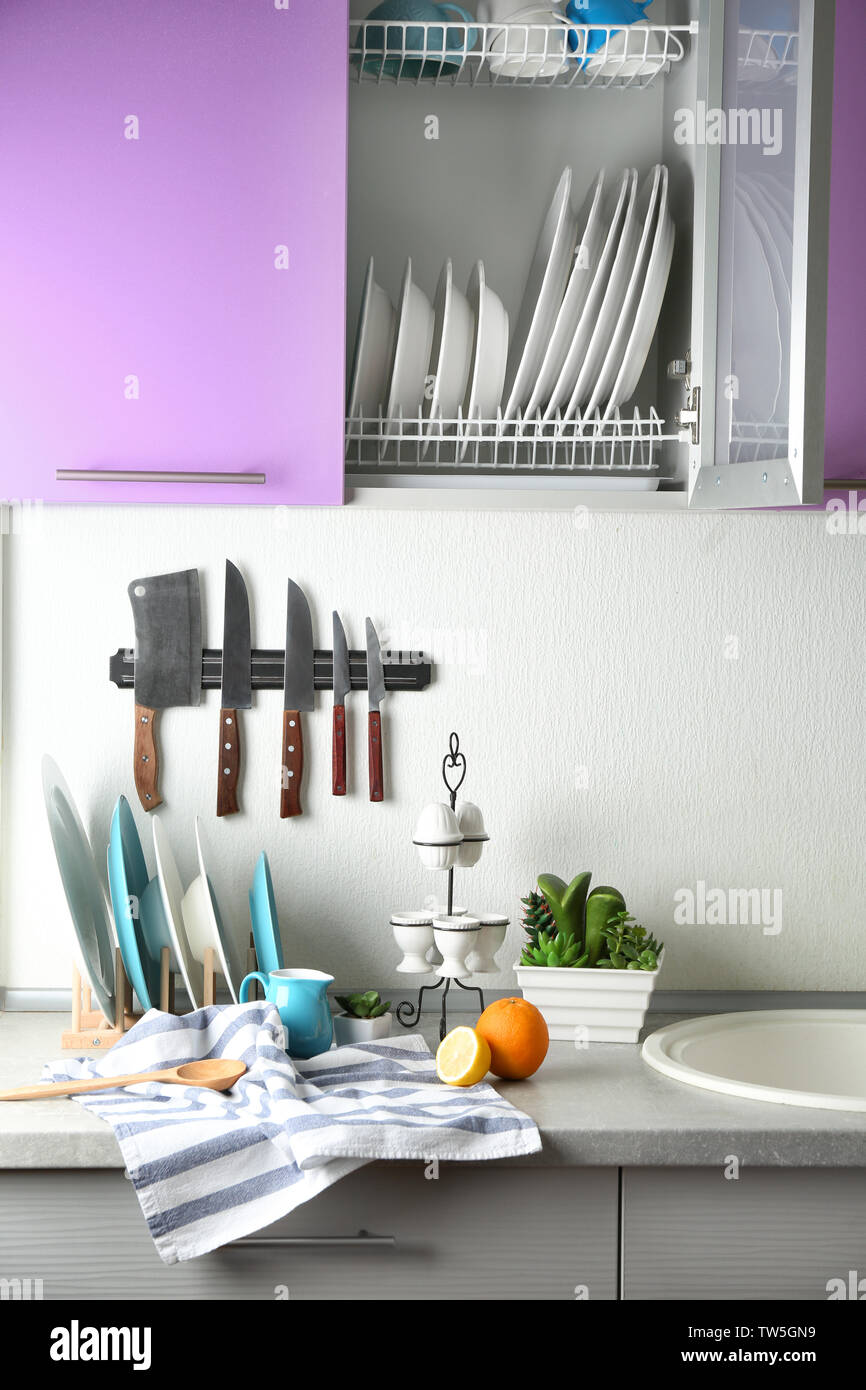 Kitchen counter with set of ceramic plates Stock Photo - Alamy