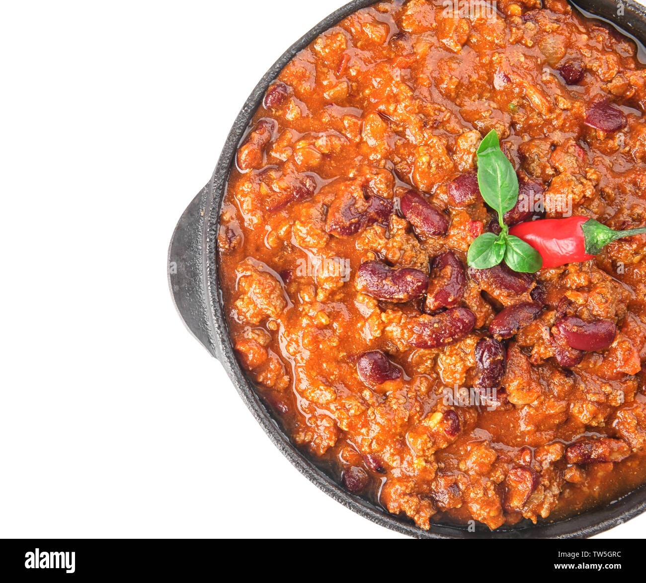 Chili con carne in frying pan on white background Stock Photo - Alamy