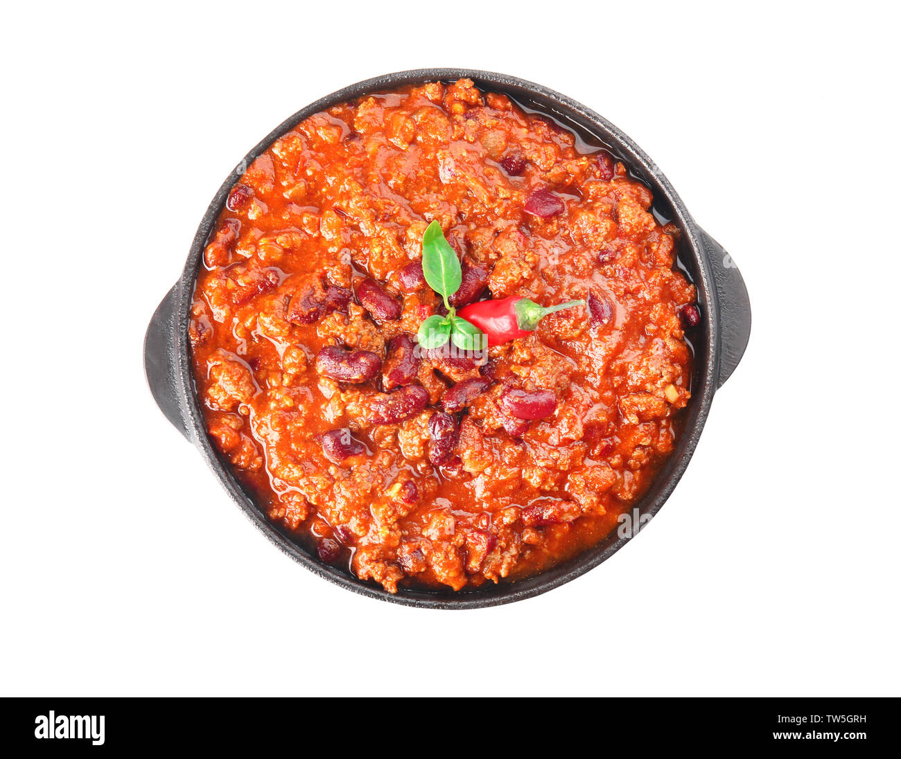 Chili con carne in frying pan on white background Stock Photo - Alamy