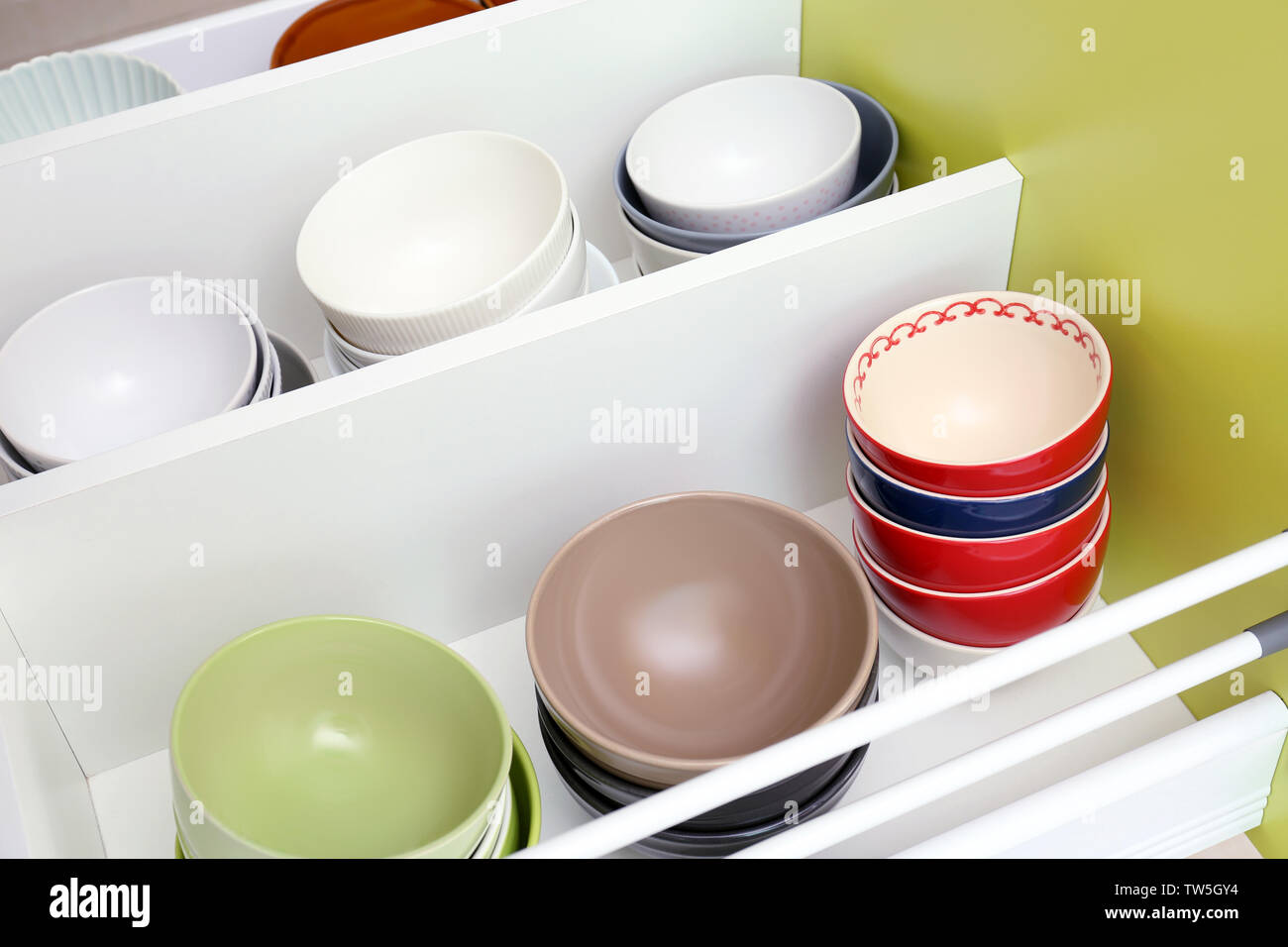 Bowls in kitchen drawer Stock Photo - Alamy