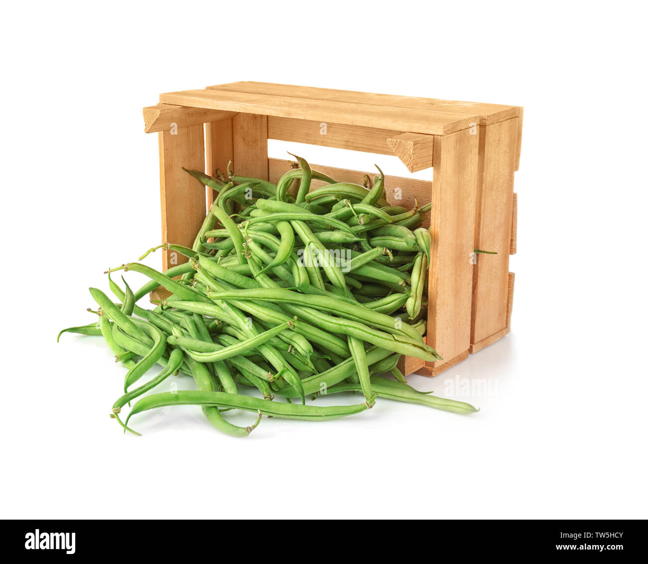 Wooden crate with fresh green beans on white background Stock Photo - Alamy