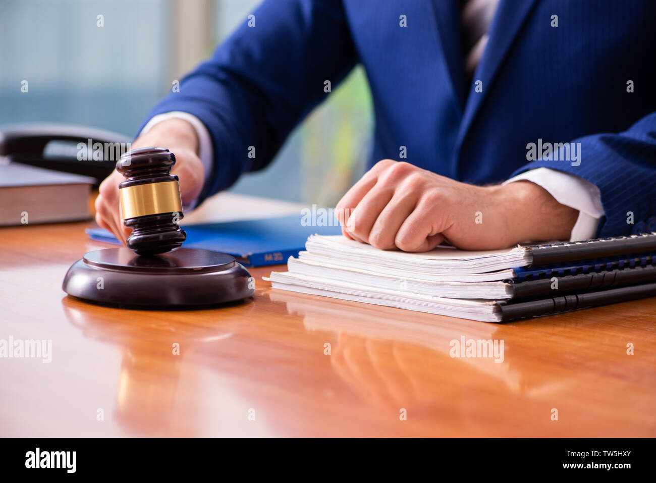 Young male judge sitting in courtroom Stock Photo - Alamy