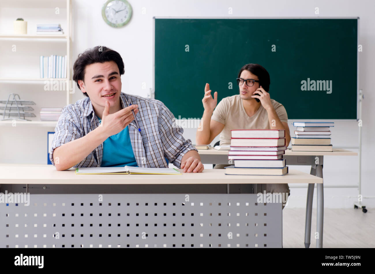 Two male students in the classroom Stock Photo - Alamy
