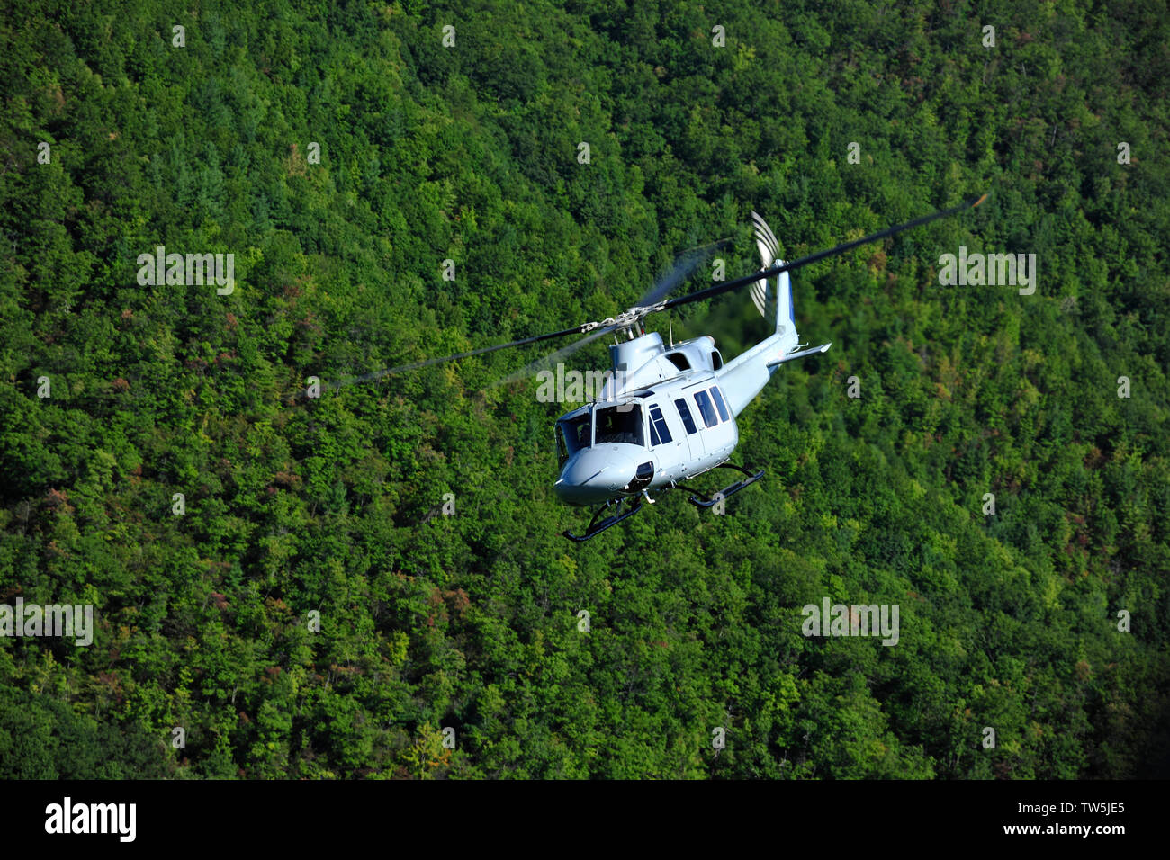 Corporate, Executive, military and law enforcement helicopter in flight ...