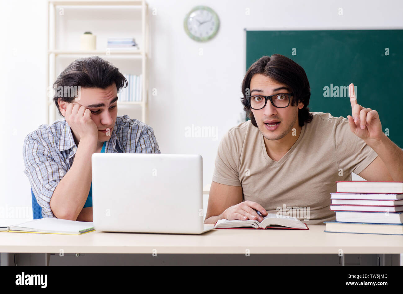 Two male students in the classroom Stock Photo - Alamy