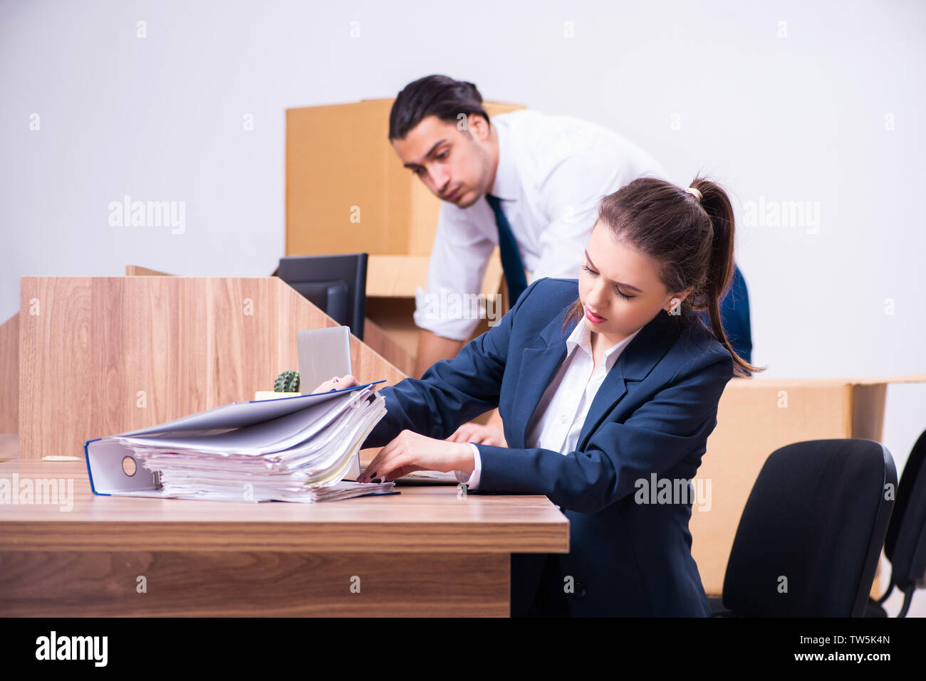 Two employees being fired from their work Stock Photo - Alamy