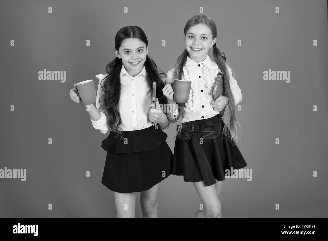 Schoolgirl hold book or notepad and mug. School routine. Having break ... Schoolgirl hold book or notepad and mug. School routine. Having break ...
