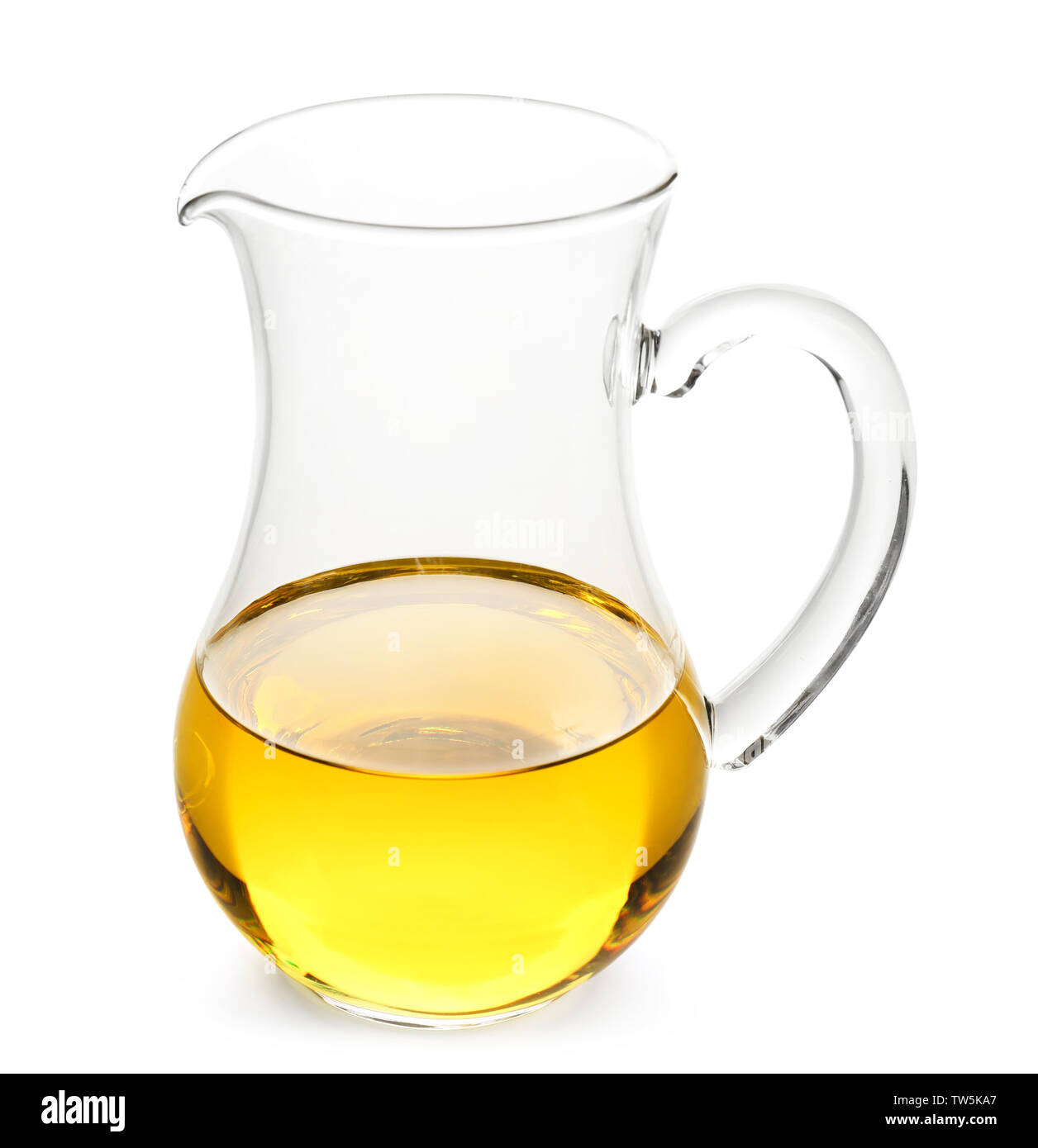 Glass pitcher with cooking oil on white background Stock Photo - Alamy