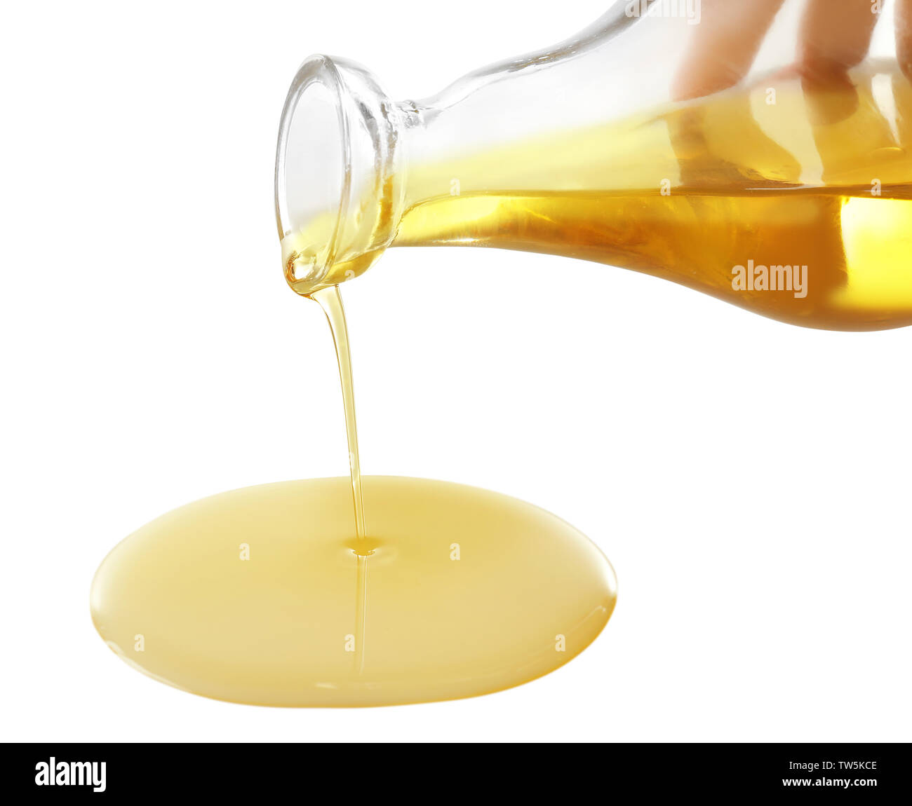 Spilling cooking oil on white background Stock Photo - Alamy