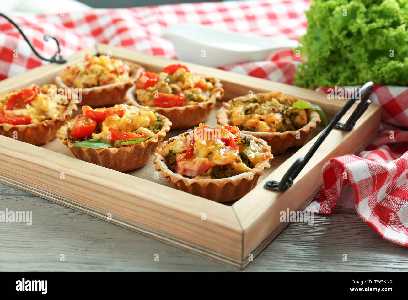 Delicious crispy tarts with broccoli on wooden tray Stock Photo - Alamy