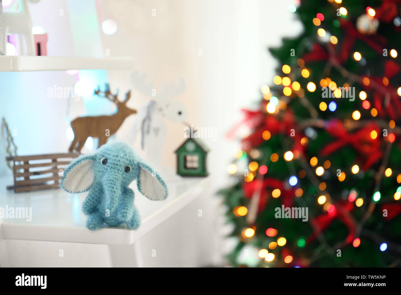 Small elephant toy on shelf at home Stock Photo - Alamy