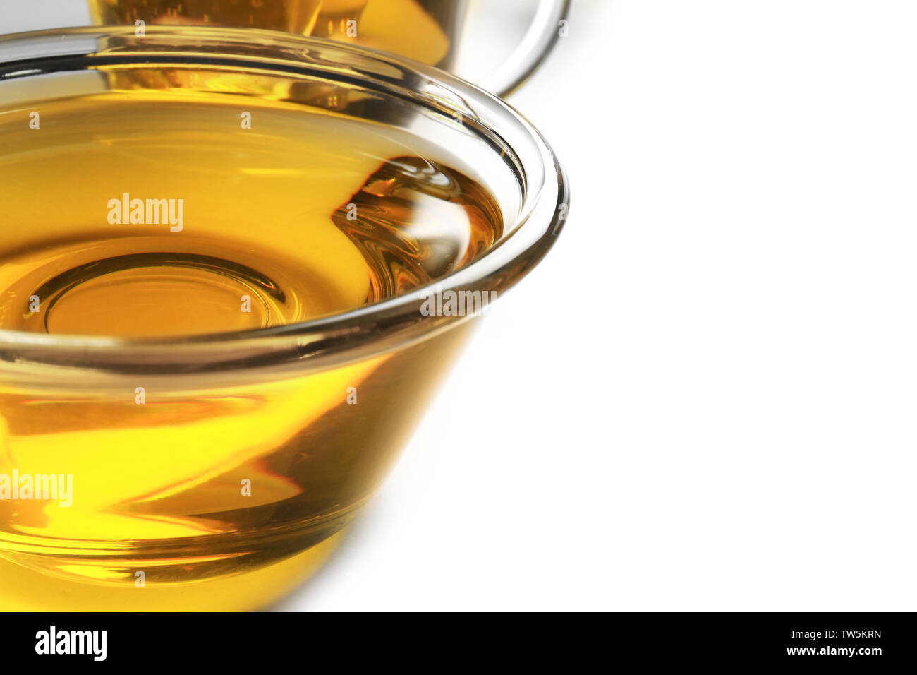 Small bowl with oil on white background Stock Photo - Alamy