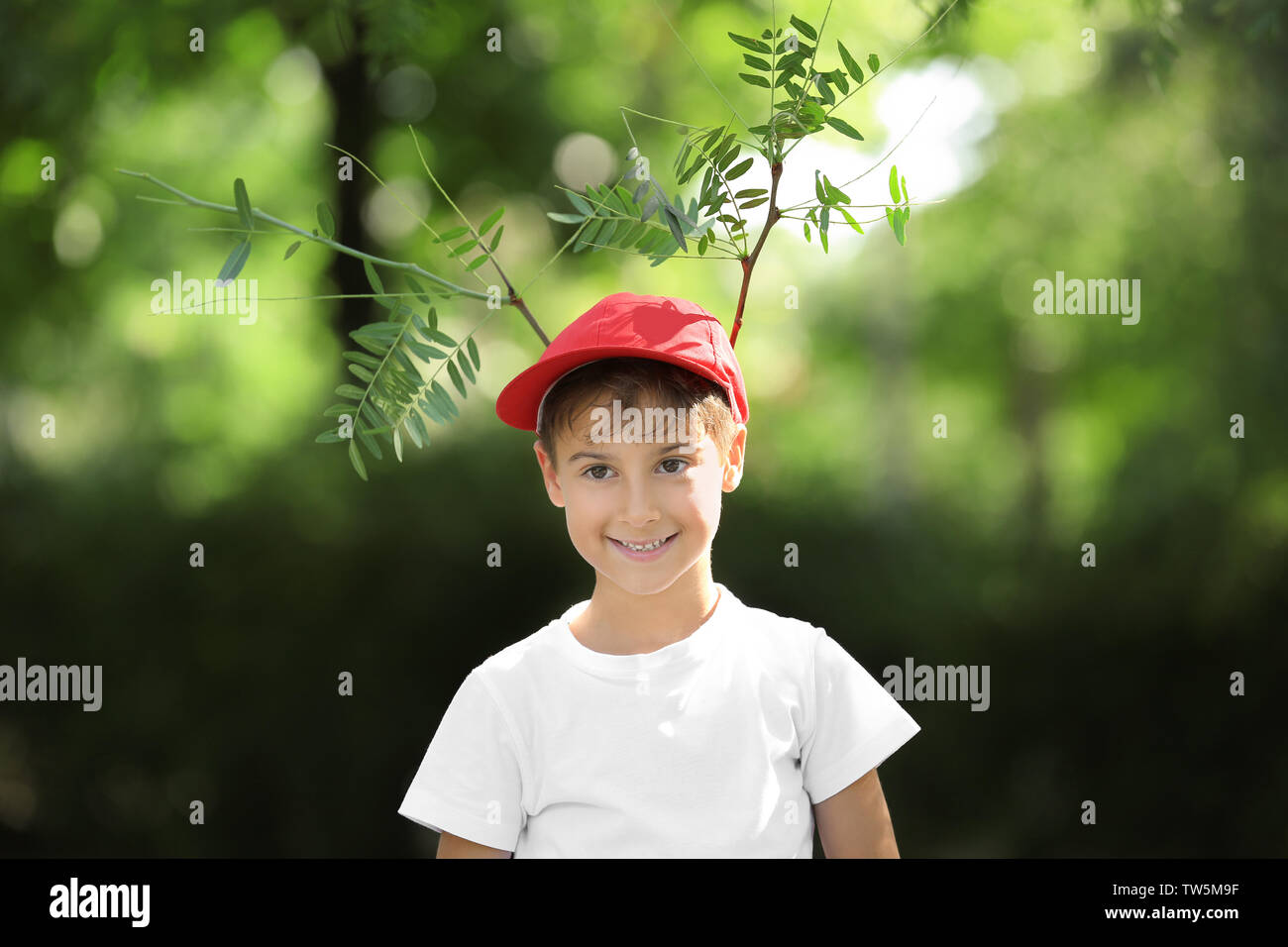 Boy with horns made of tree branches outdoors Stock Photo - Alamy