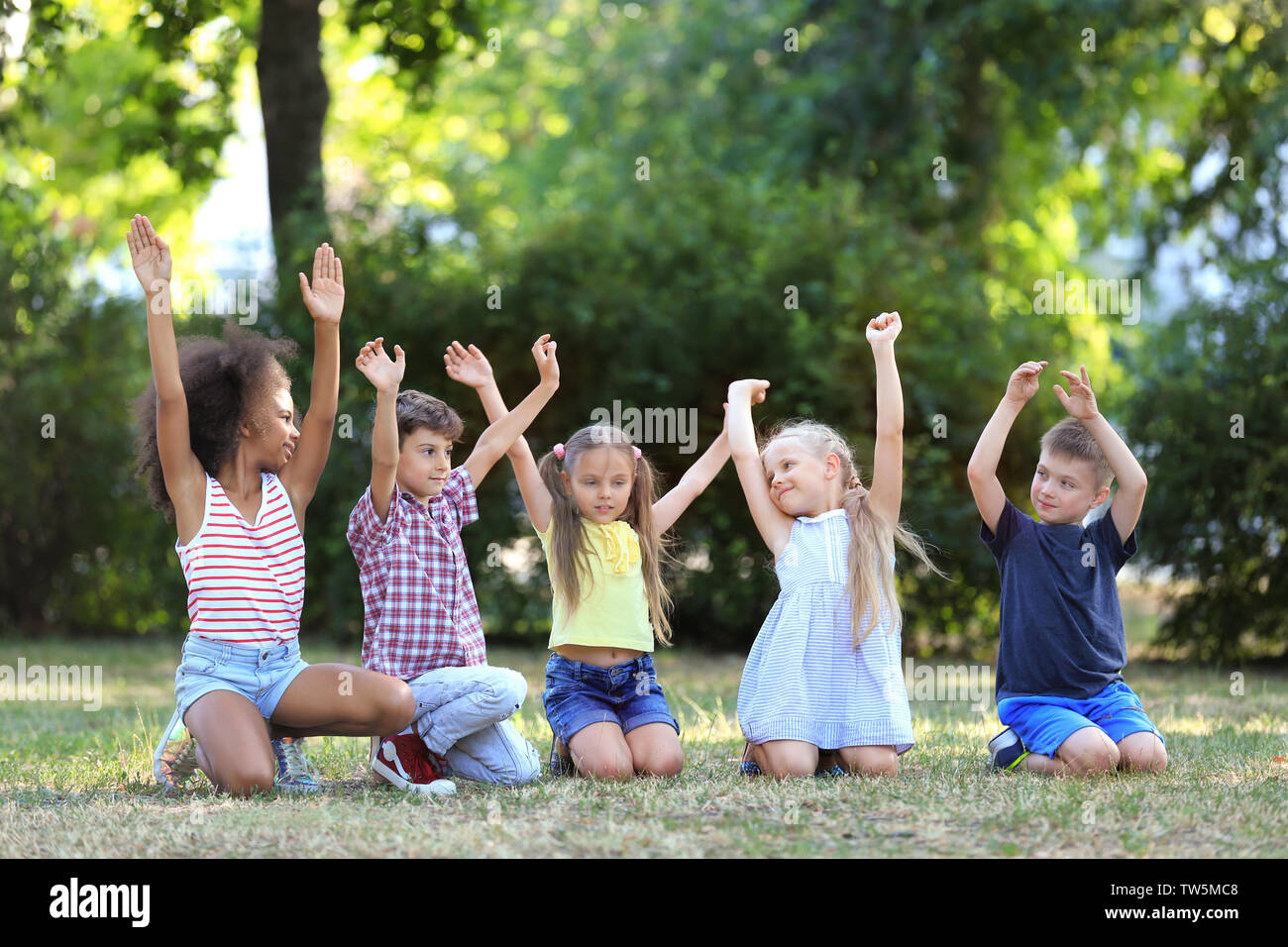 Group of children playing in the park Stock Photo - Alamy