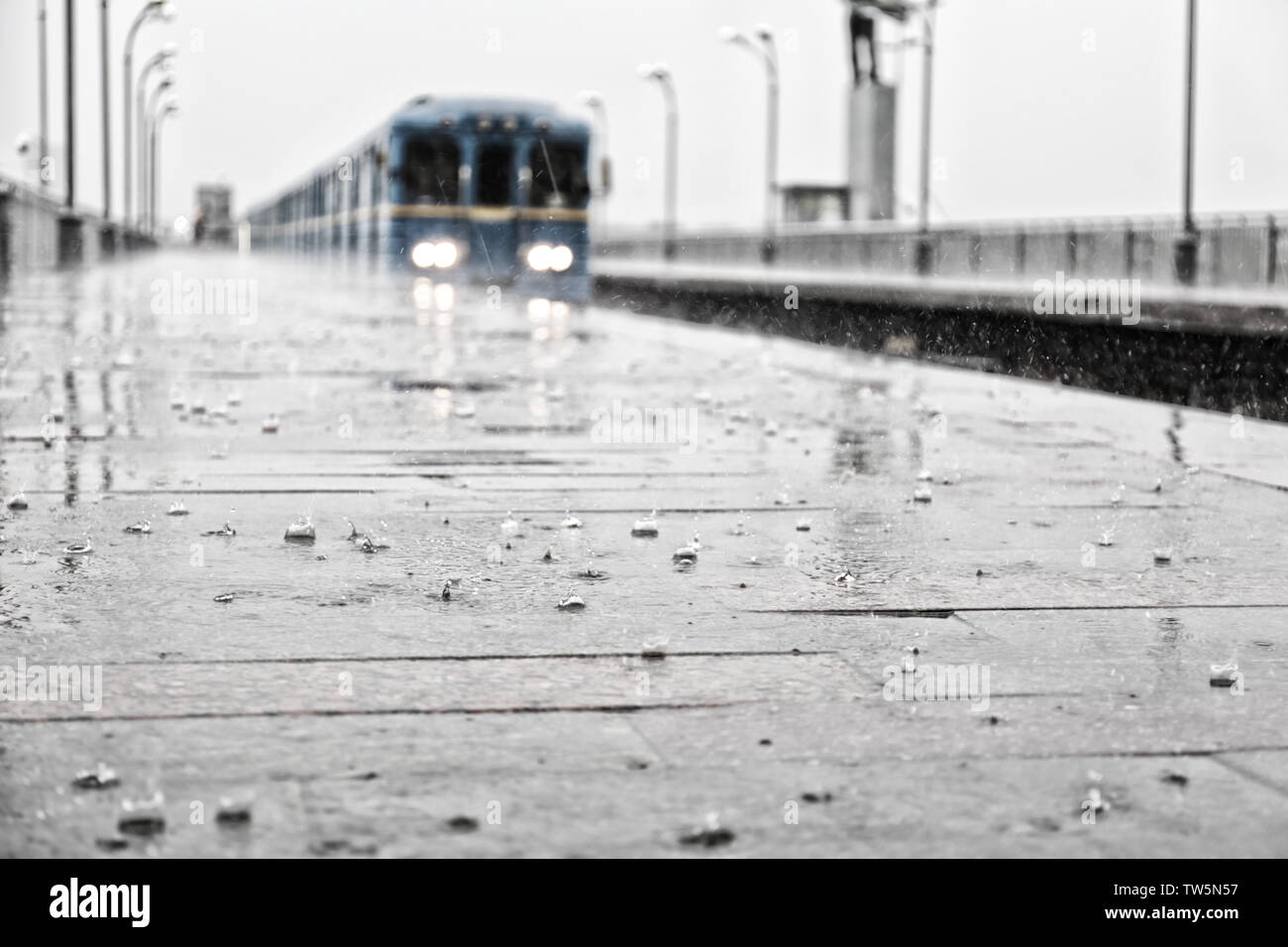 Railway station on rainy day Stock Photo - Alamy