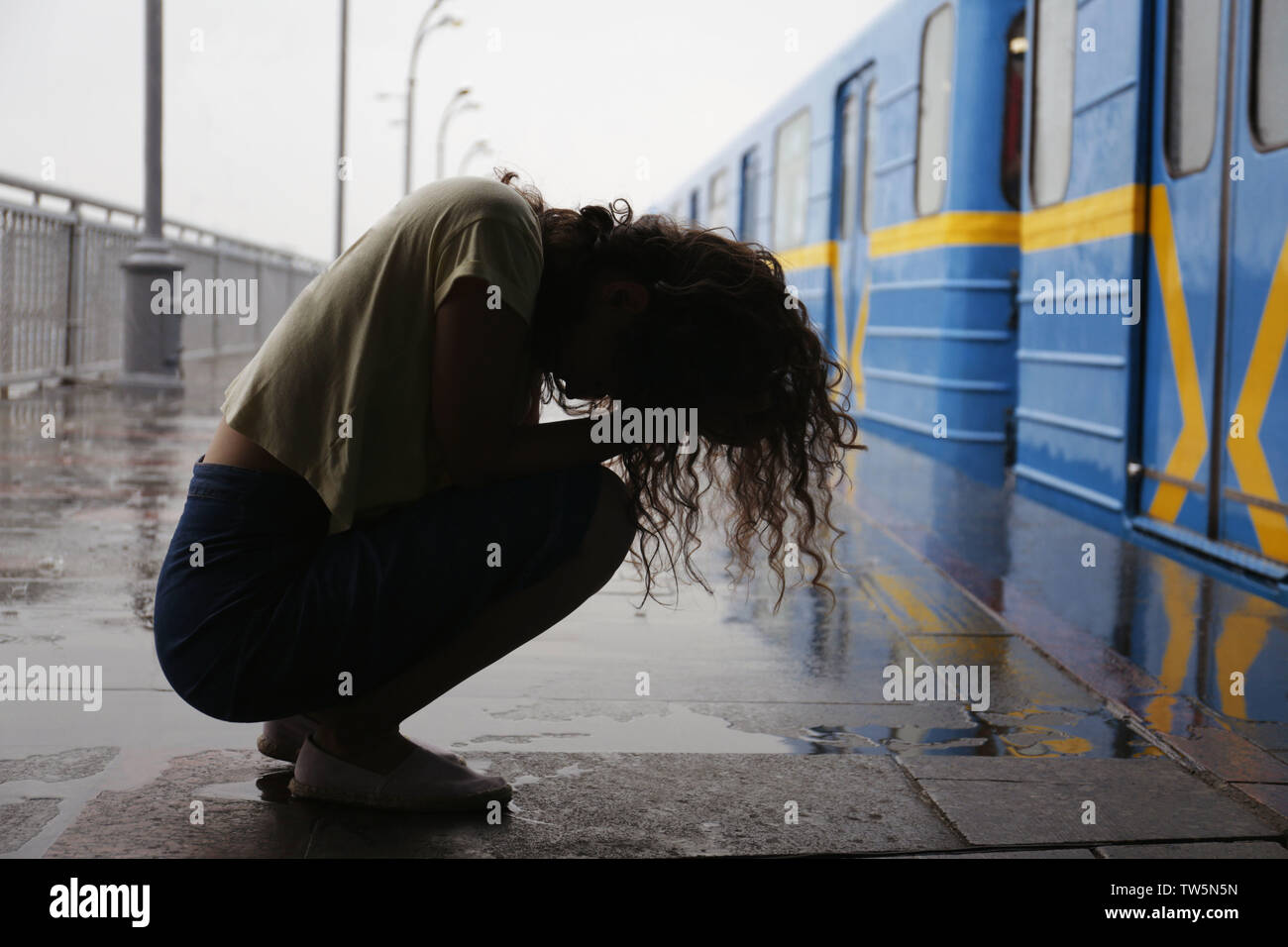 Woman railway station worried hi-res stock photography and images - Alamy