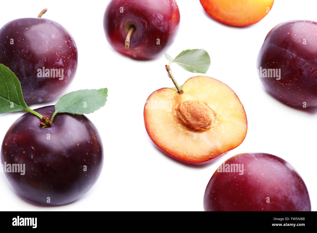 Fresh ripe plums on white background Stock Photo - Alamy