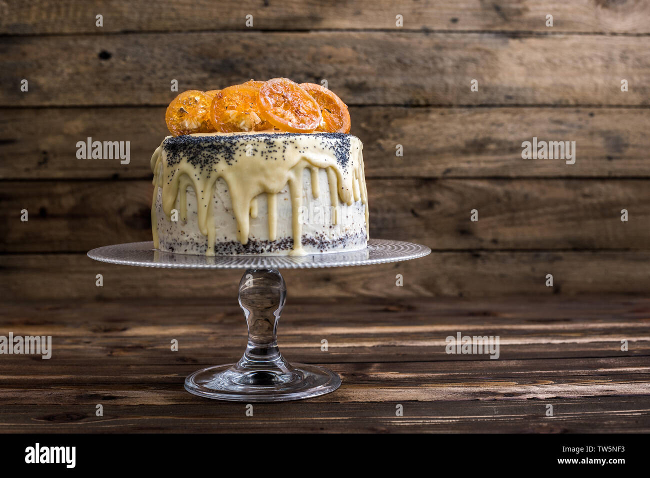 Poppy Seed Cake with White Chocolate and Caramelized Orange on Rustic ...