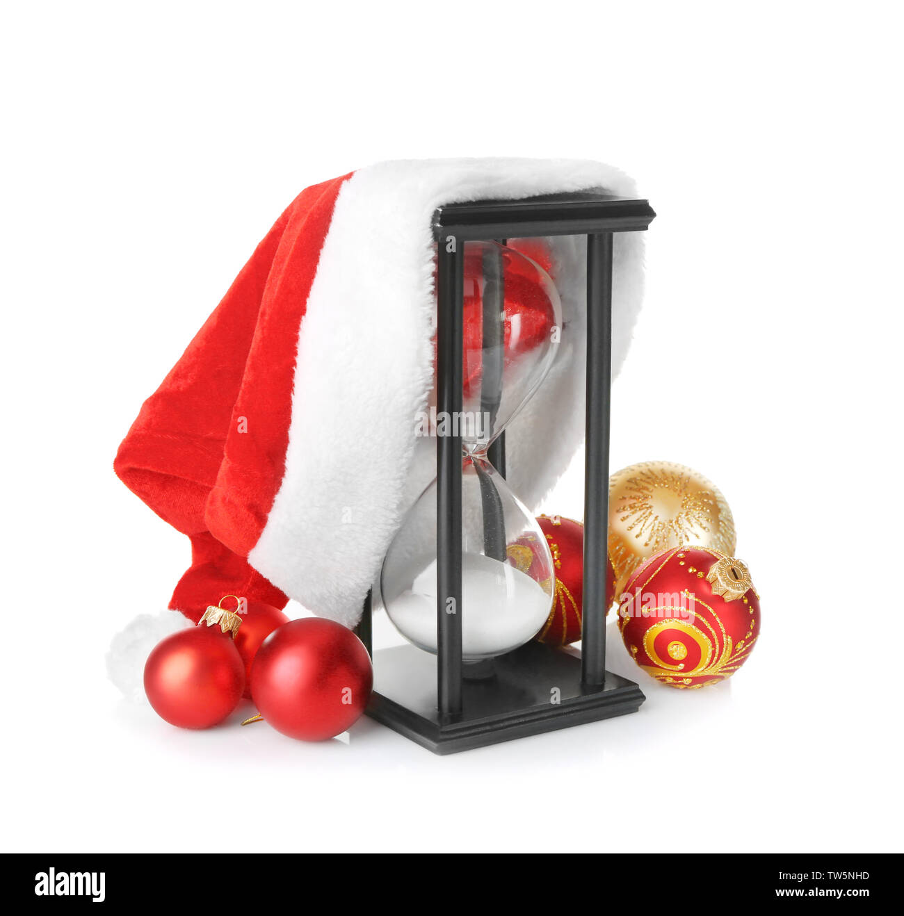 Hourglass with Santa hat and decorations on white background. Christmas ...