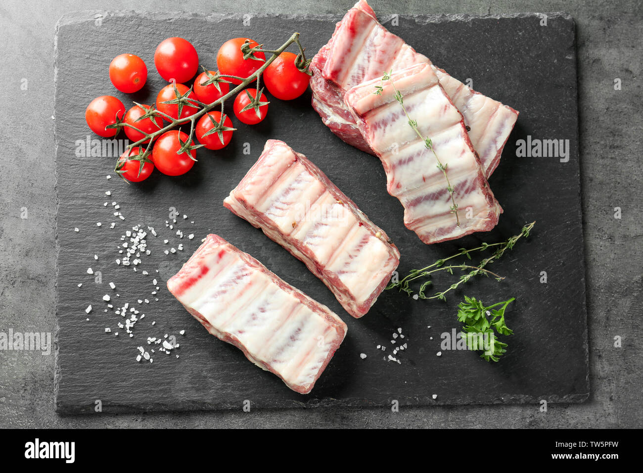 Fresh raw ribs on slate plate Stock Photo - Alamy