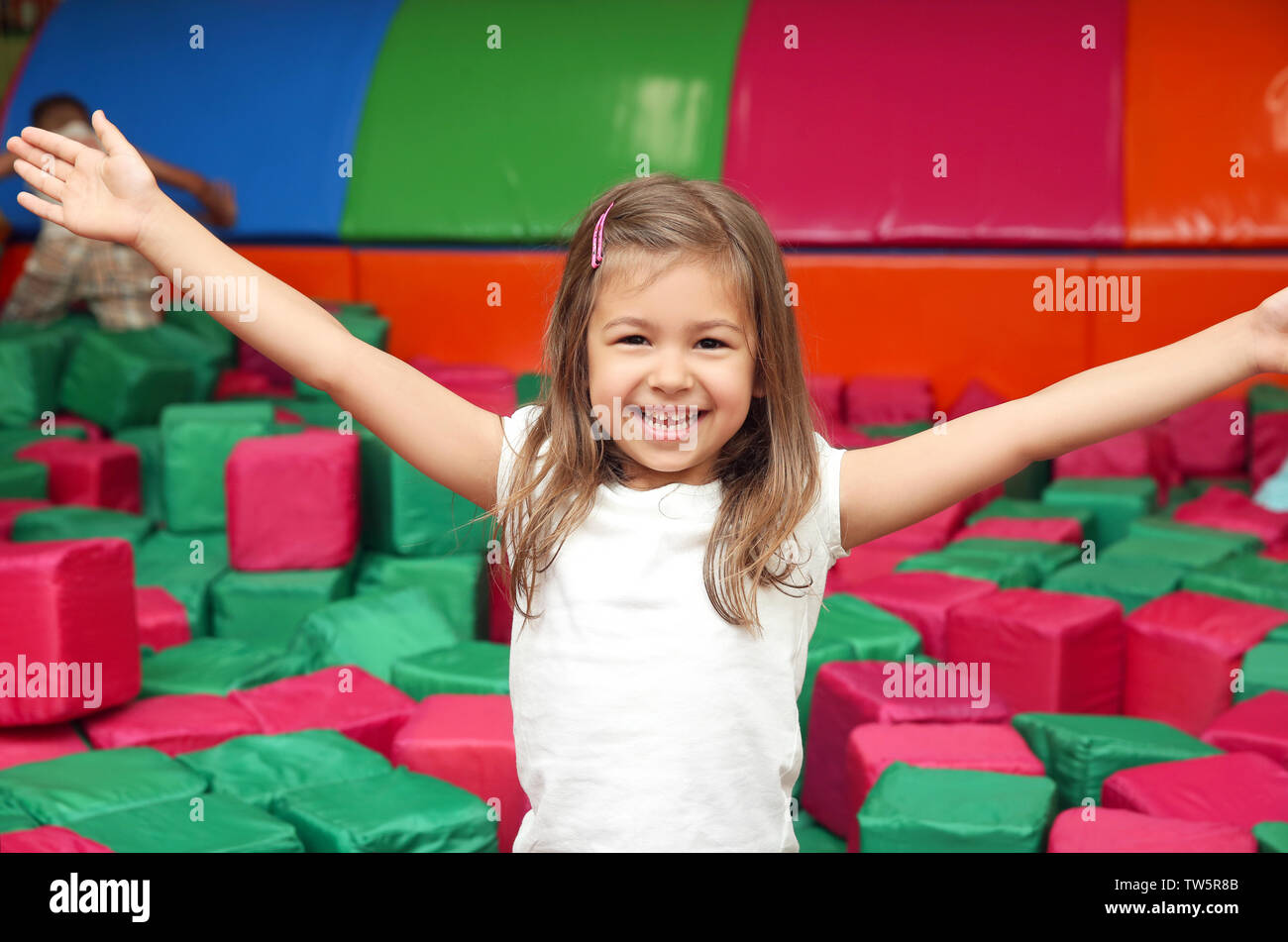 Cute girl in entertainment center Stock Photo - Alamy