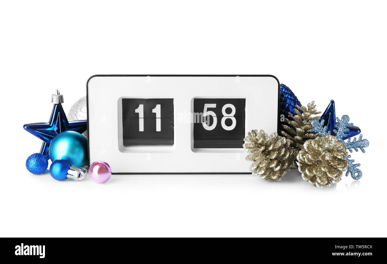 Digital alarm clock and decorations on white background. Christmas ...