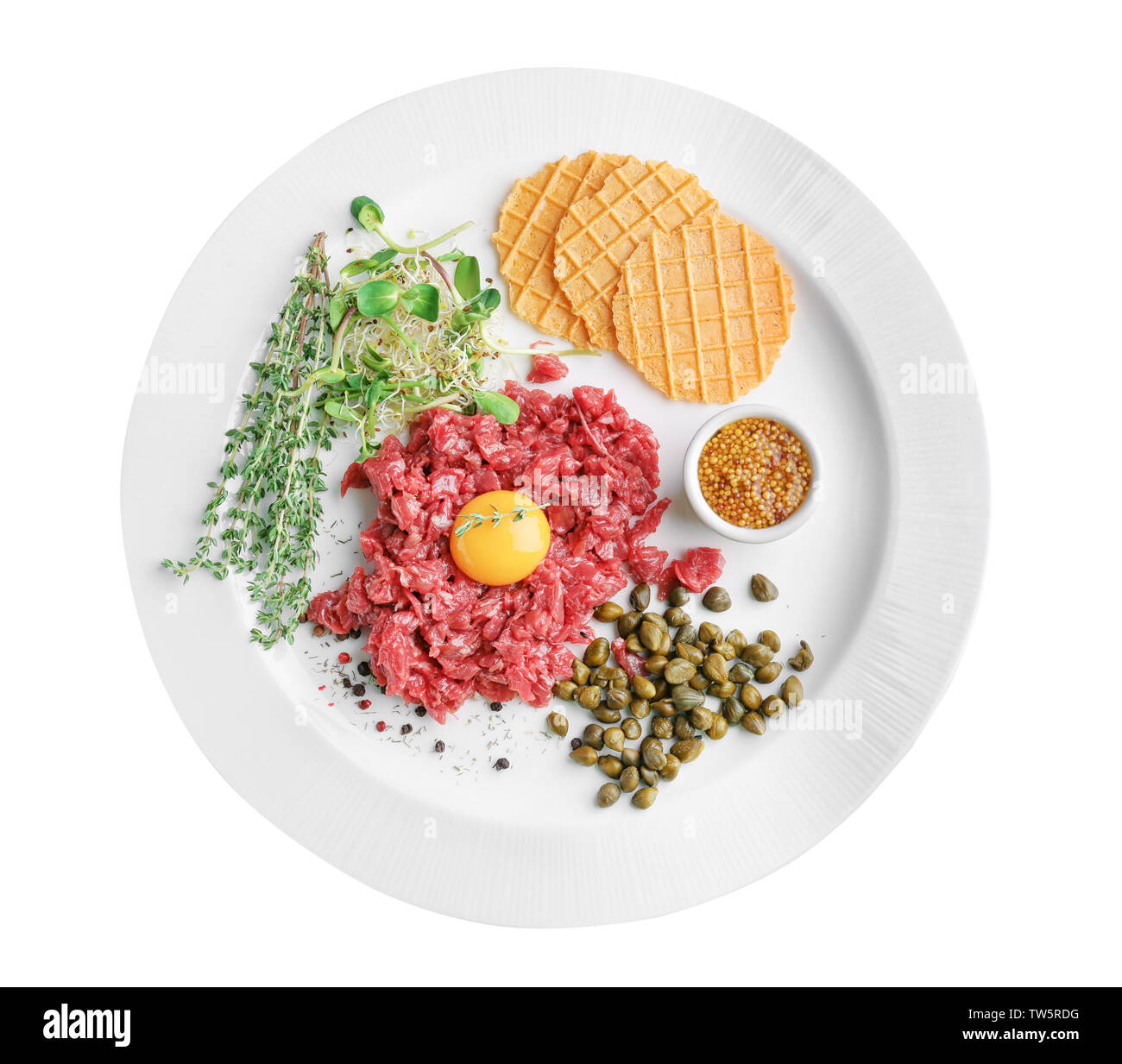 Plate with delicious steak tartare and wafers on white background Stock ...