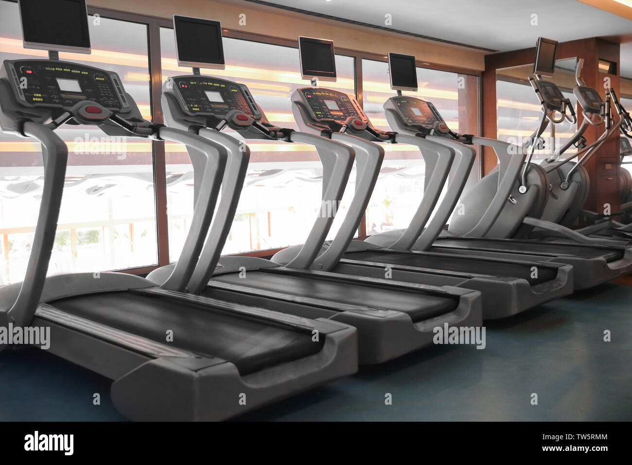 Modern treadmills in gym Stock Photo - Alamy