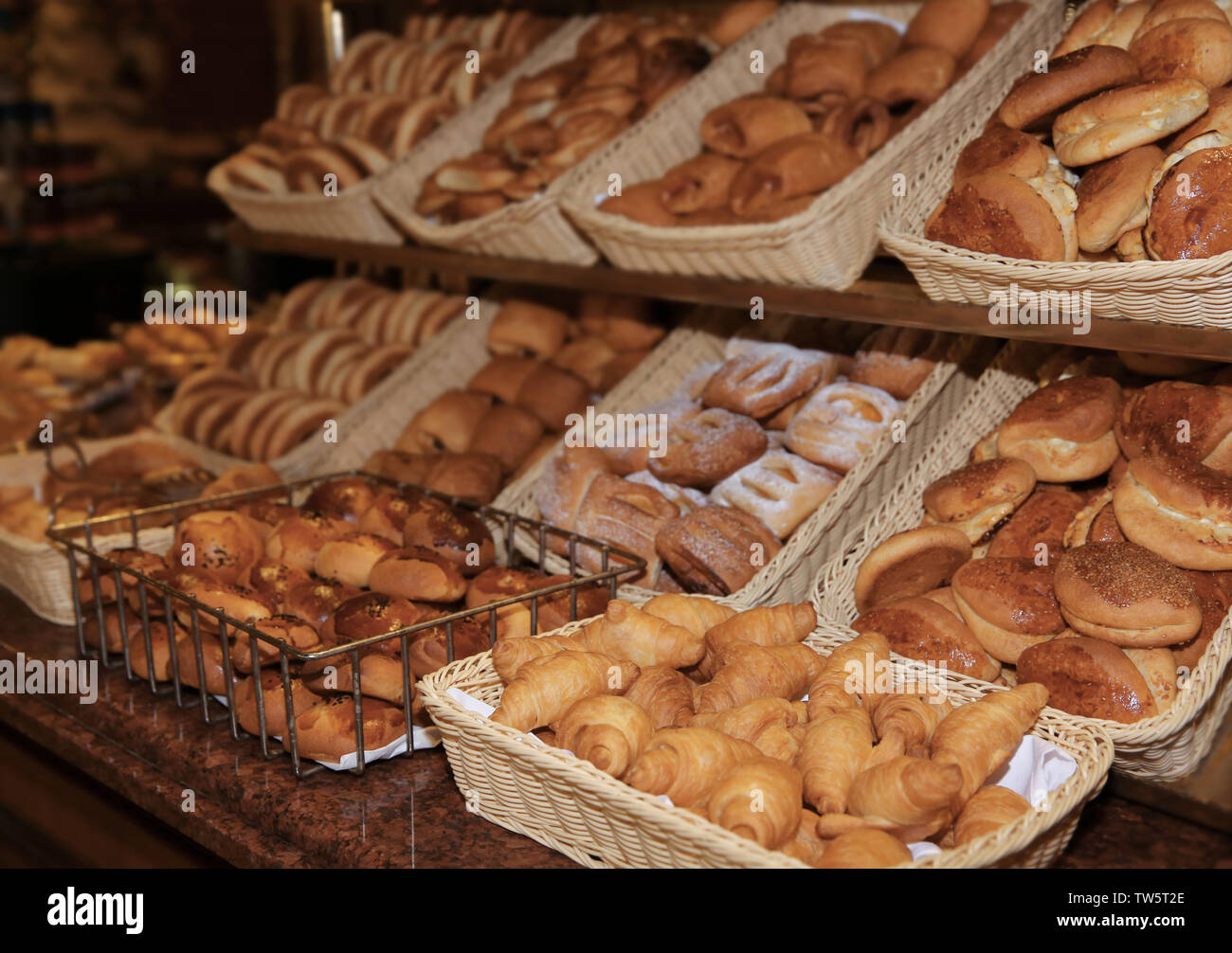 Different kinds of bakery products in baskets at buffet Stock Photo - Alamy