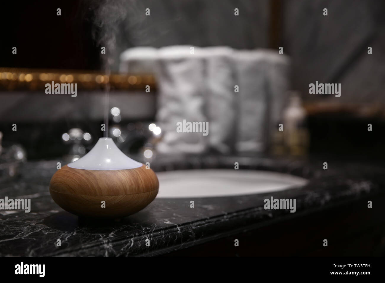 Aroma oil diffuser near marble sink in bathroom Stock Photo - Alamy