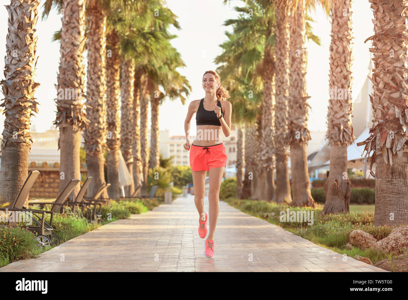 Beautiful woman running in park hi-res stock photography and images - Alamy