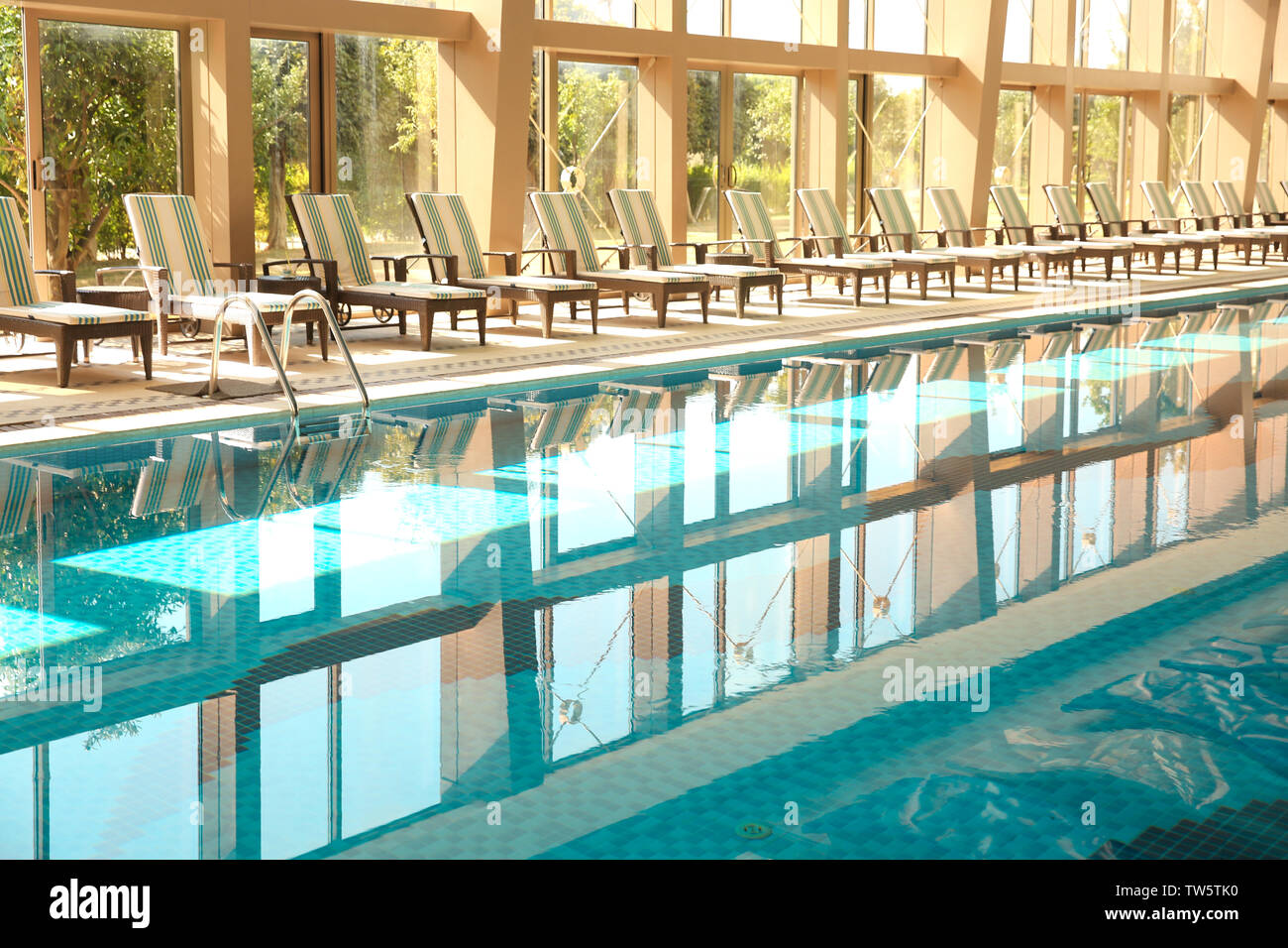 Beautiful swimming pool in modern hotel Stock Photo - Alamy