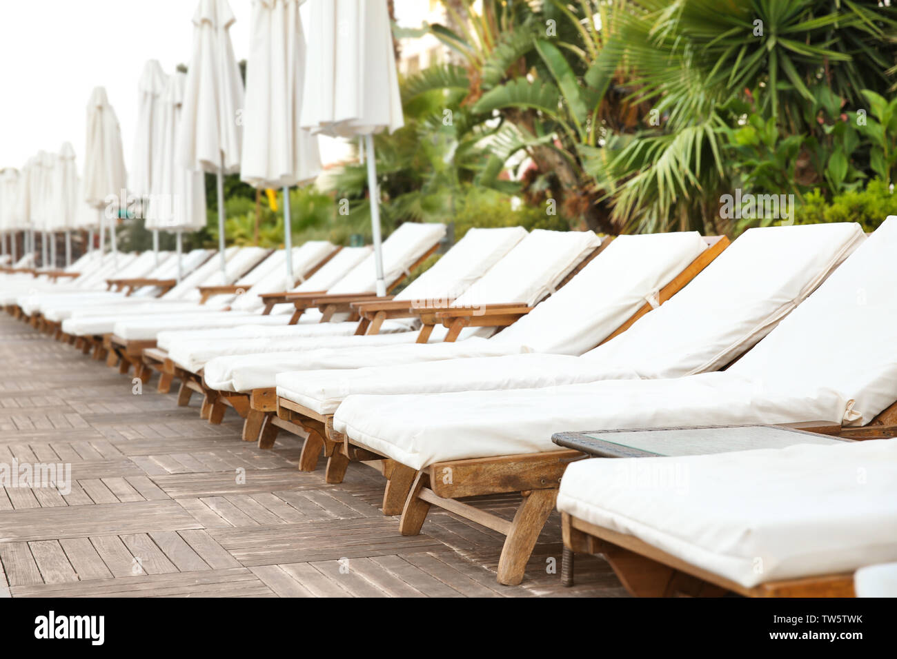 Empty sunbeds at luxury hotel Stock Photo - Alamy