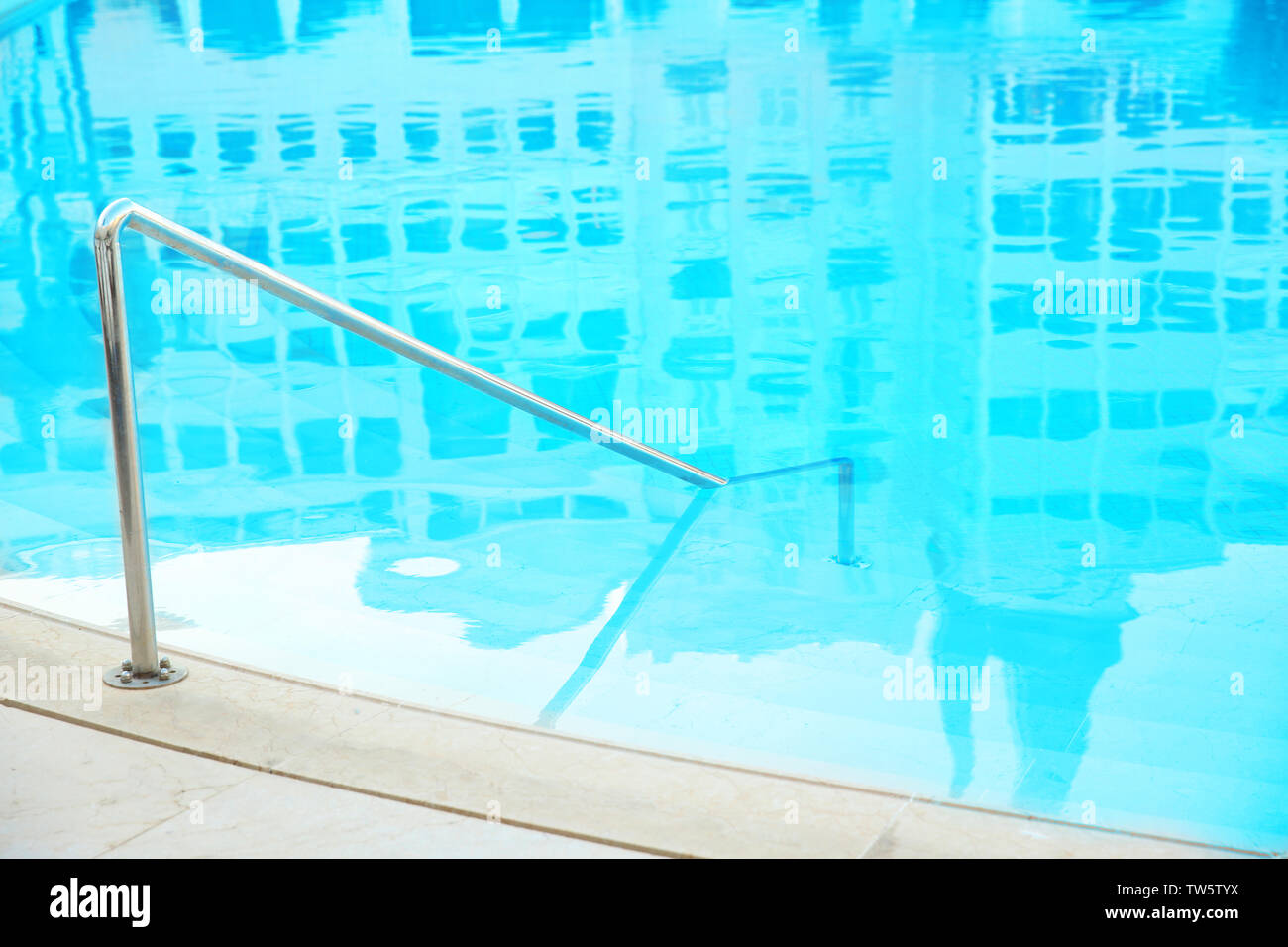 Modern swimming pool with stairs in luxury hotel Stock Photo - Alamy
