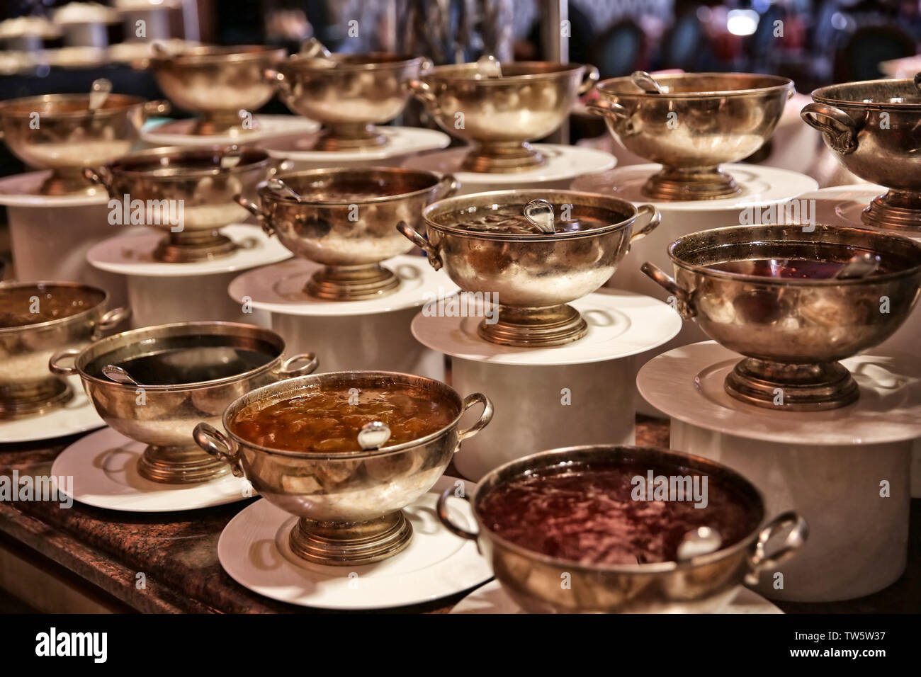 Different kinds of jams in bowls on table at buffet Stock Photo - Alamy