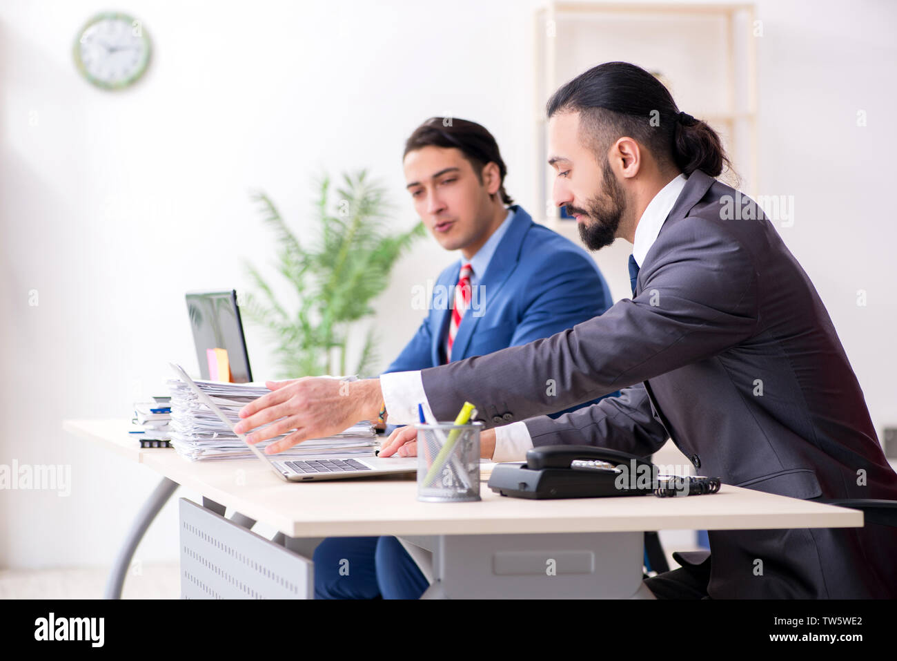 Two male colleagues in the office Stock Photo - Alamy