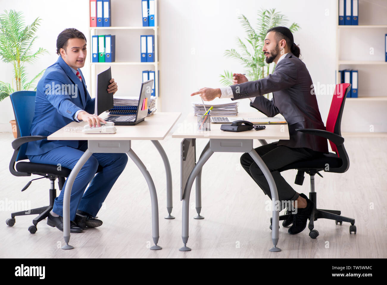 Two male colleagues in the office Stock Photo - Alamy