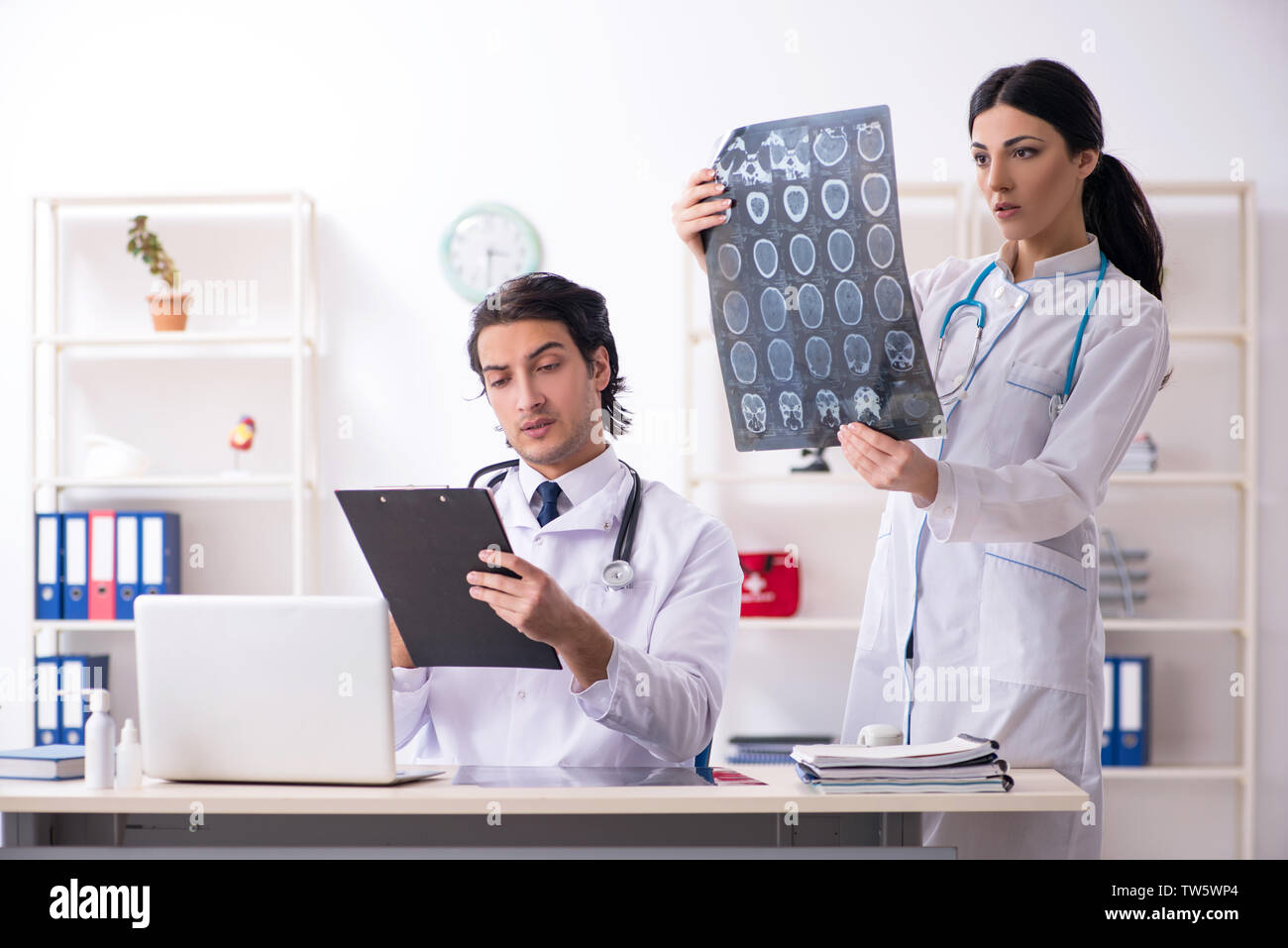 Two young doctors working in the clinic Stock Photo - Alamy