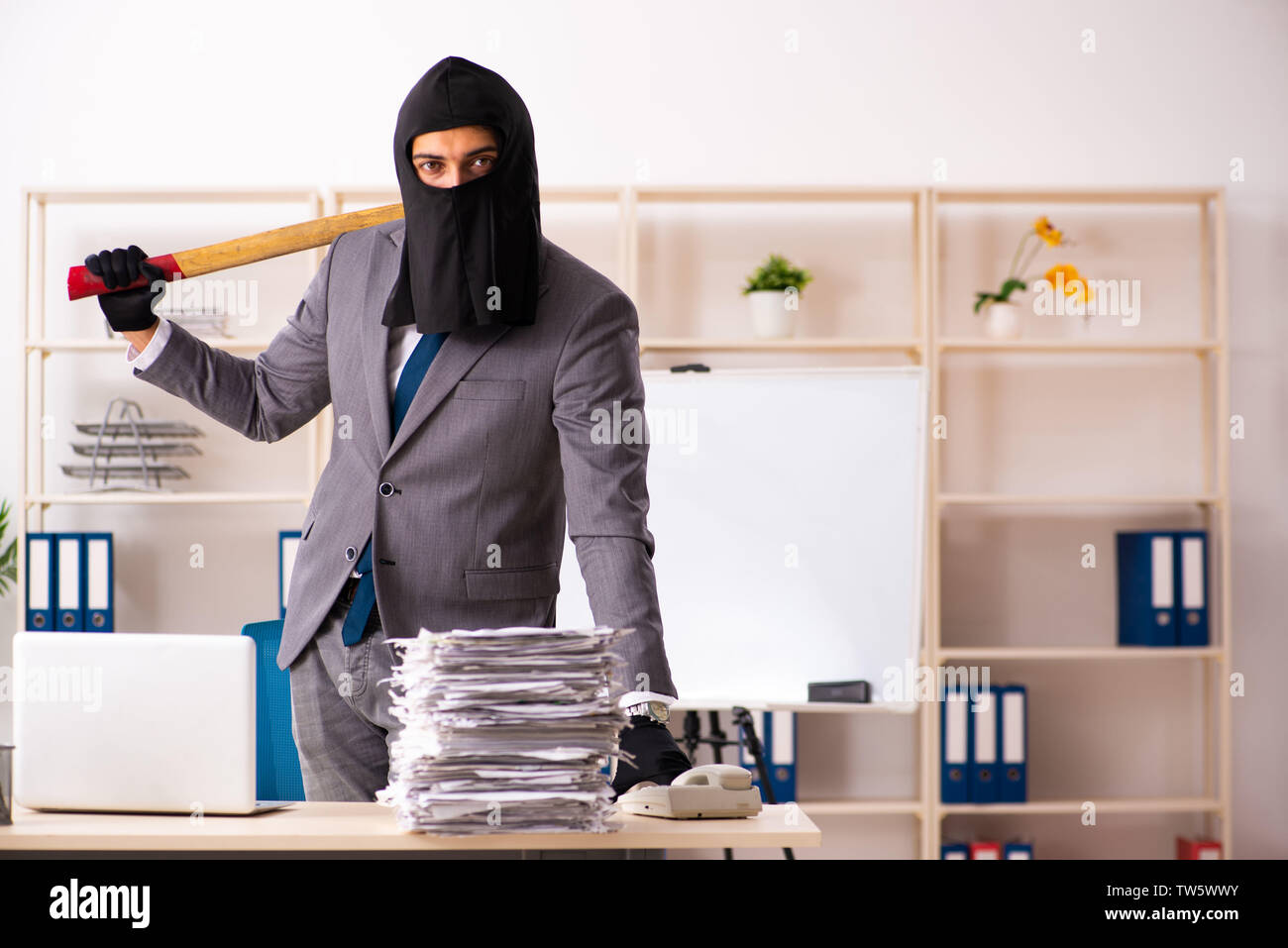 Male gangster stealing information from the office Stock Photo - Alamy